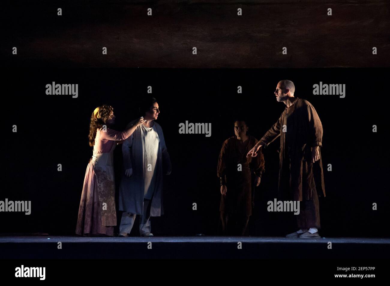 Cast members perform on the stage as they take part in the opera ...