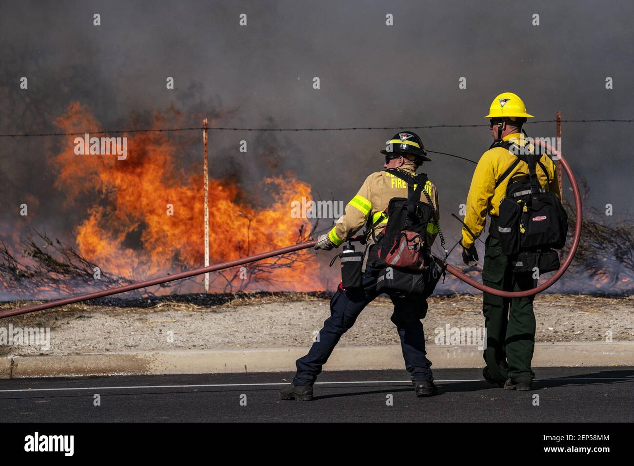 Firefighters battle the Easy Fire near the Ronald Reagan Presidential ...