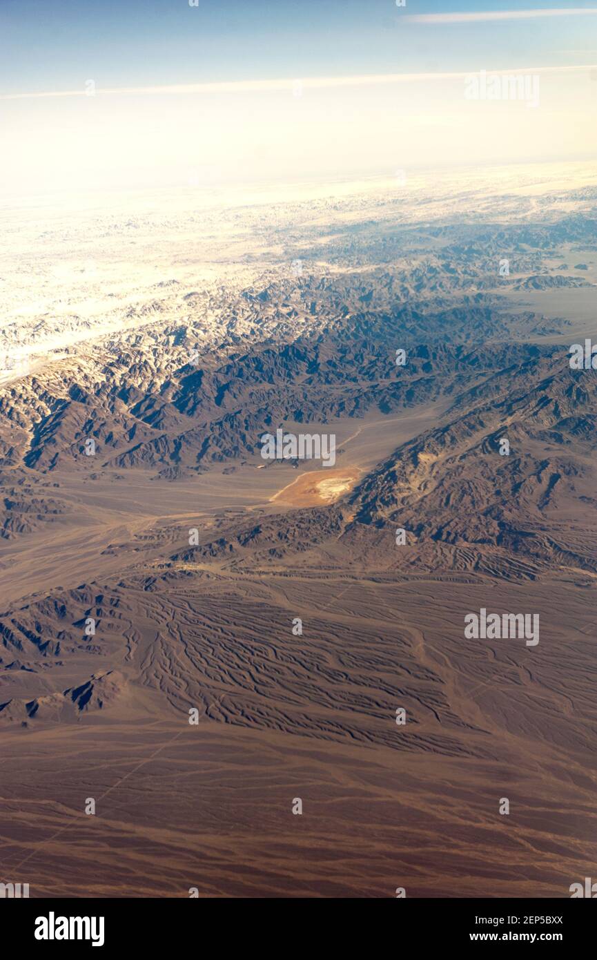 An aerial view of mountains whose tops are covered with snow from 5000 ...