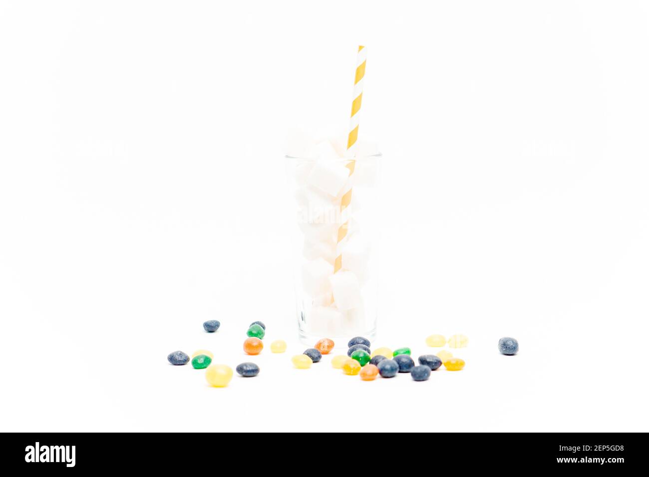 glass with sugar with a straw candy dragee sweets calories Stock Photo ...