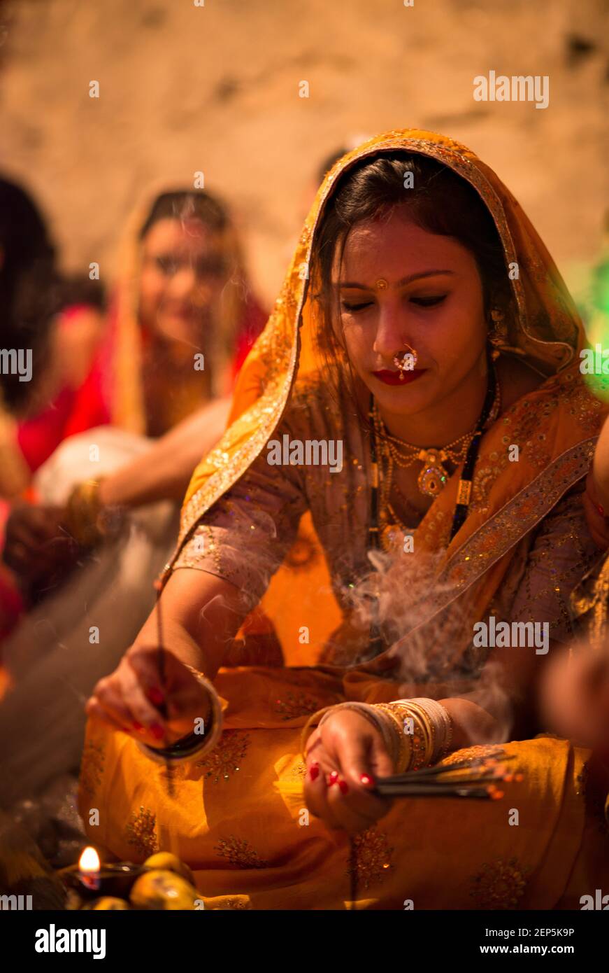 A devotee performs a ritual during the Chhath puja festival. The Chhath ...