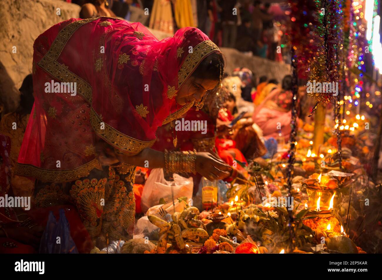 A devotee performs a ritual during the Chhath puja festival. The Chhath ...