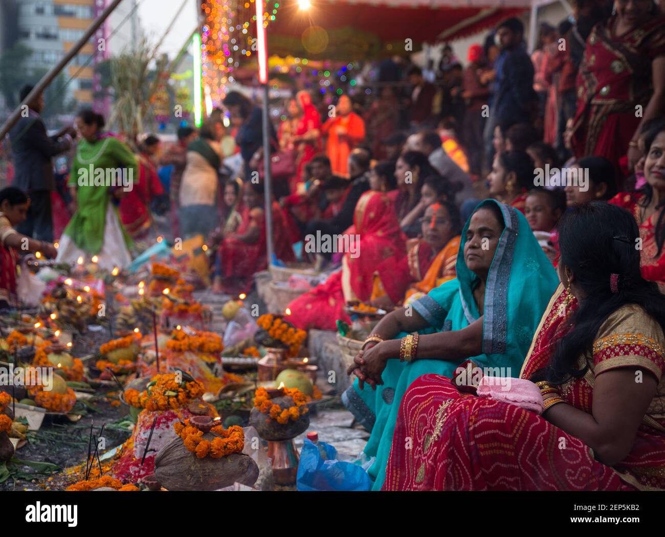 A devotee takes part in a ritual to worship the sun god during the ...