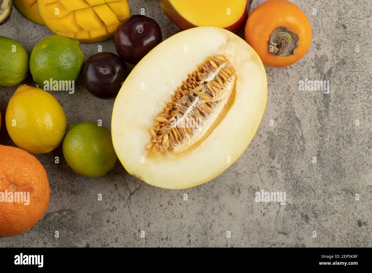 Pile of fresh whole fruit composition on marble surface Stock Photo - Alamy