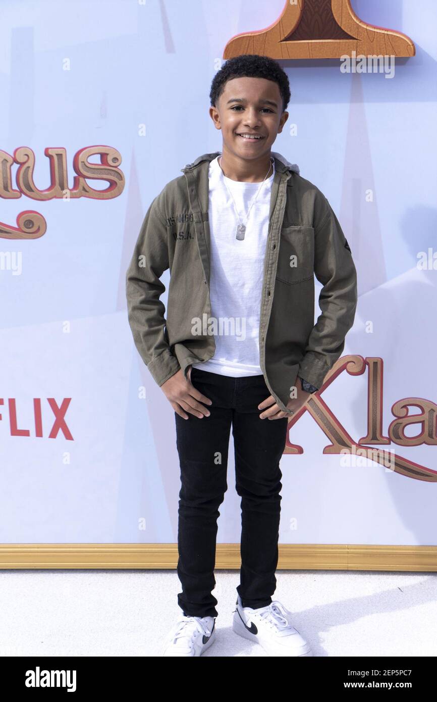 Cameron J. Wright walking the red carpet for the premiere of Klaus held at the Regency Bruin ...