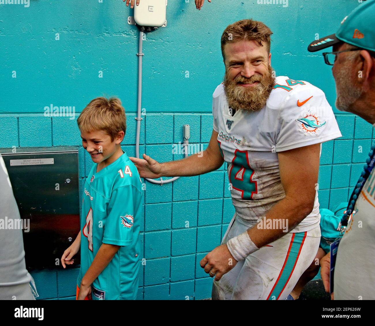 Miami Dolphins quarterback Ryan Fitzpatrick, with one of his sons after ...