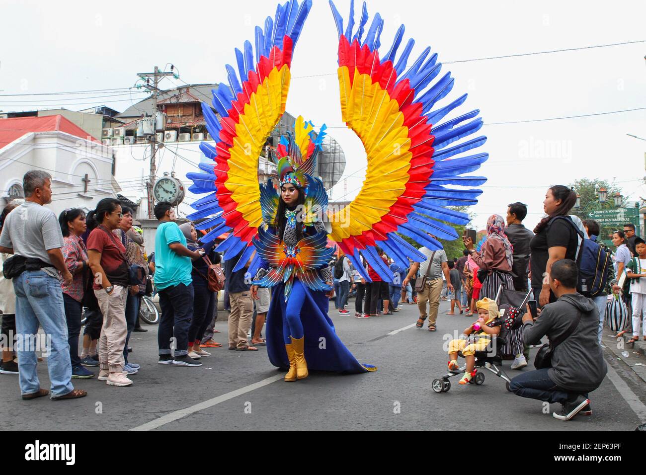 An artist uses Javanese traditional clothing called Batik during The ...