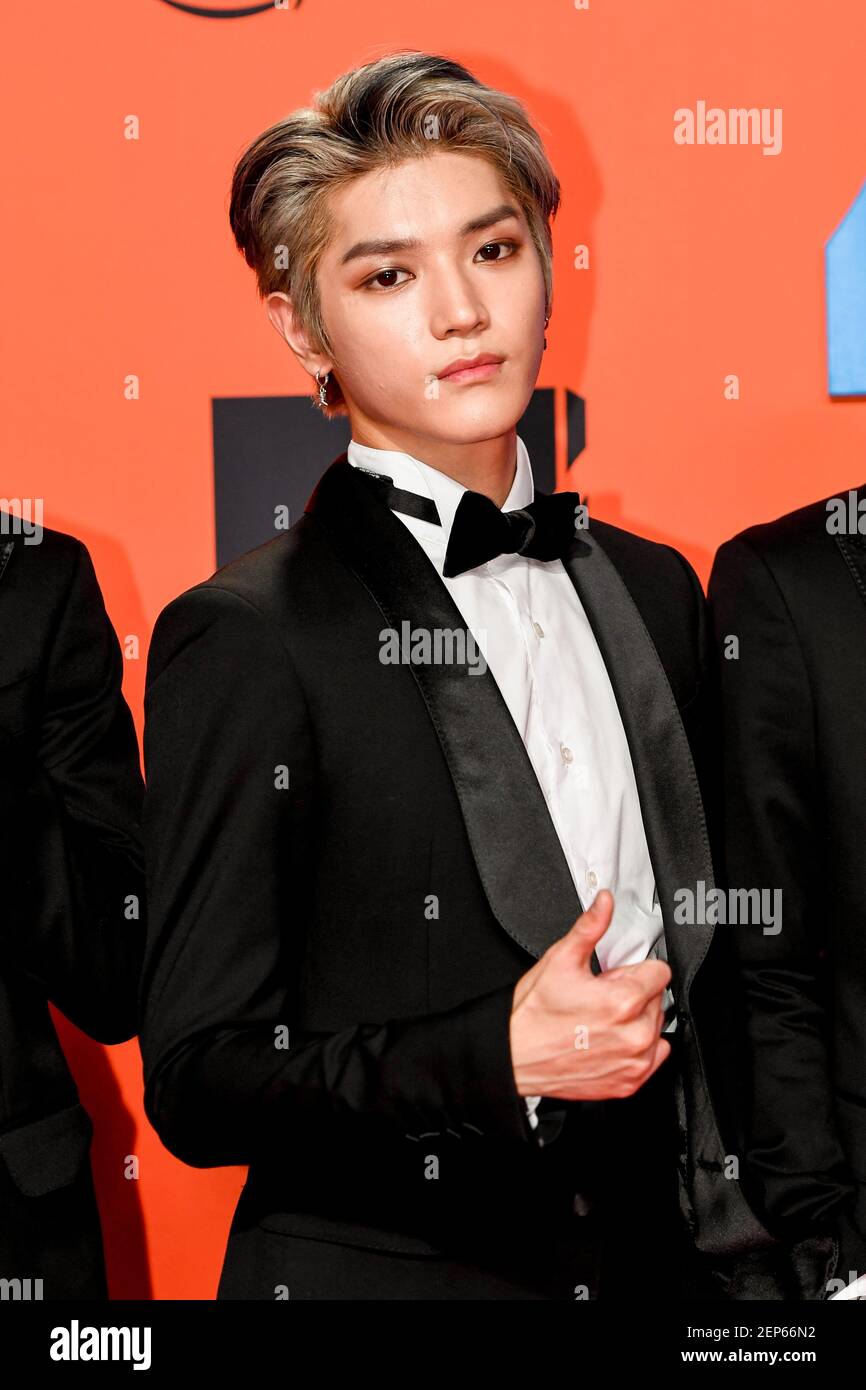 Johnny, Haechan, Mark, Jaehyun, Taeyong, Yuta, Taeil, and Doyoung of NCT 127 during the MTV ...