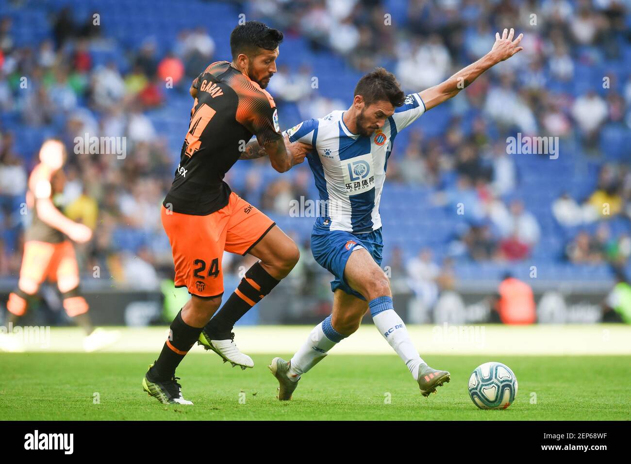 Facundo Ferreyra of RCD Espanyol and Ezequiel Garay of Valencia CF ...