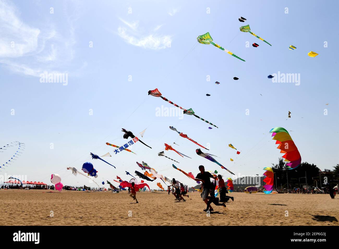 People are flying kites at 2019 Xiamen kite festival on beach in Xiamen ...