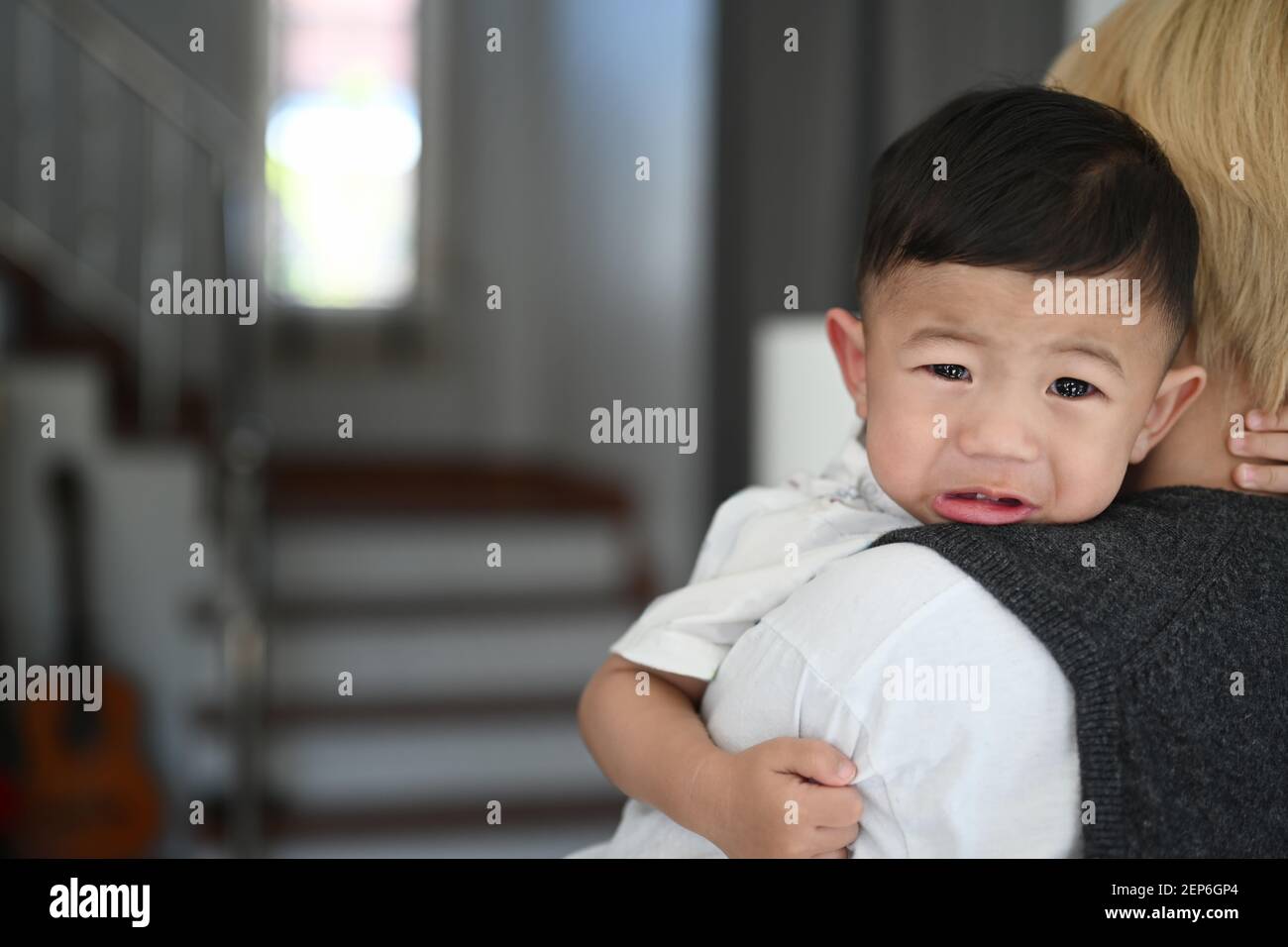 Mother Comforting Crying Boy High Resolution Stock Photography and ...