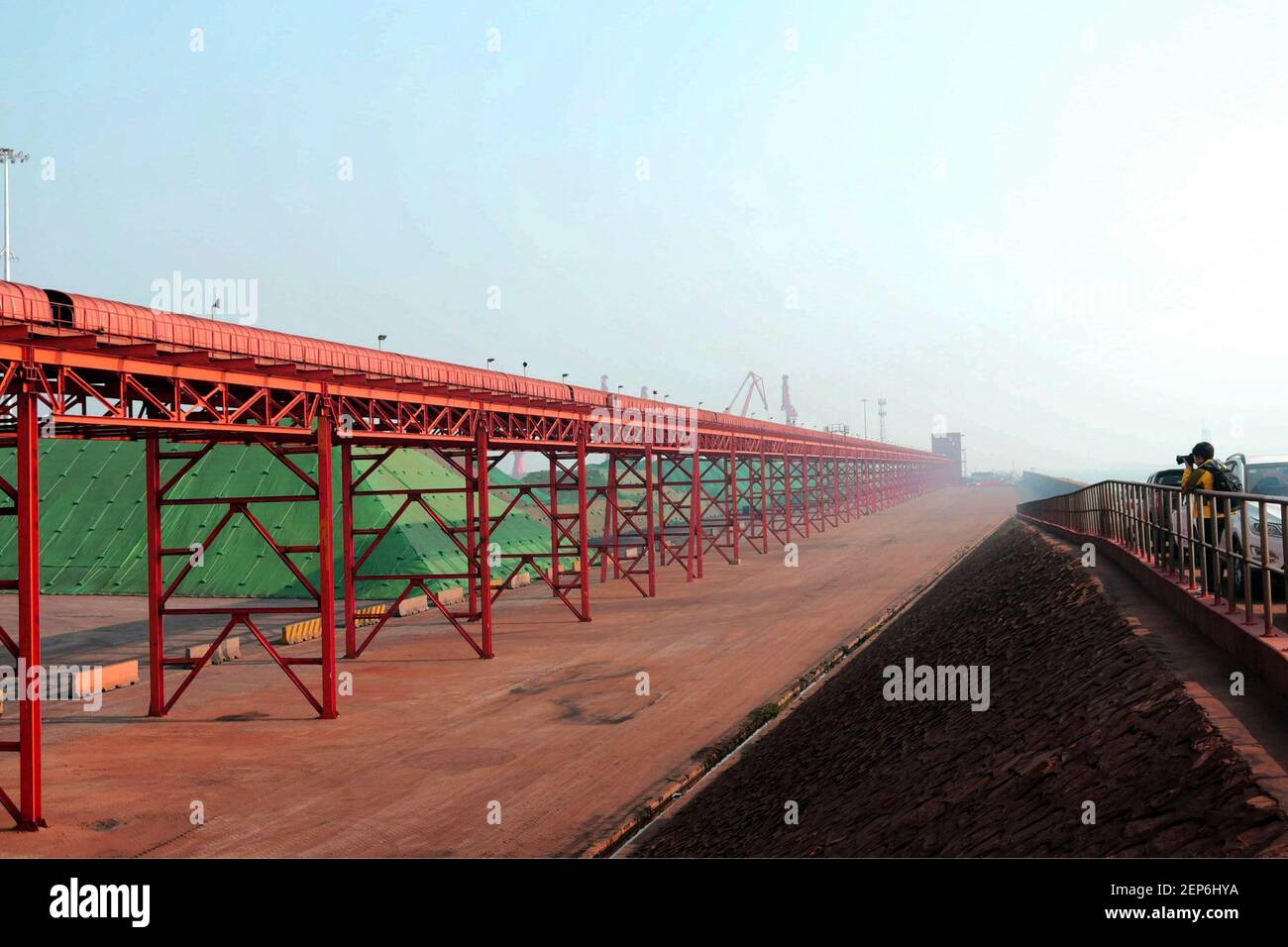 Shandong,CHINA-Cargo ships unload imported iron ore at Dongjiakou port ...