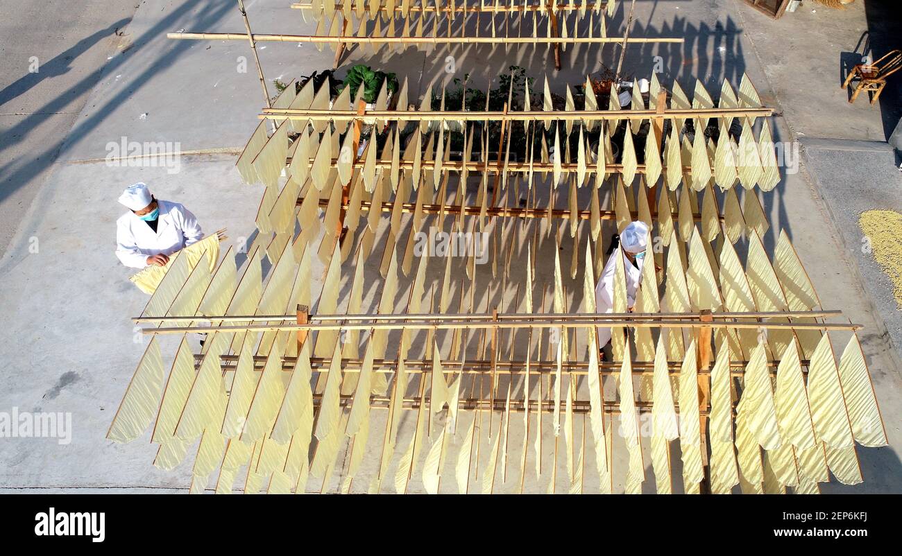 People dry tofu skin on a drying shack in Xianju county, Taizhou city ...