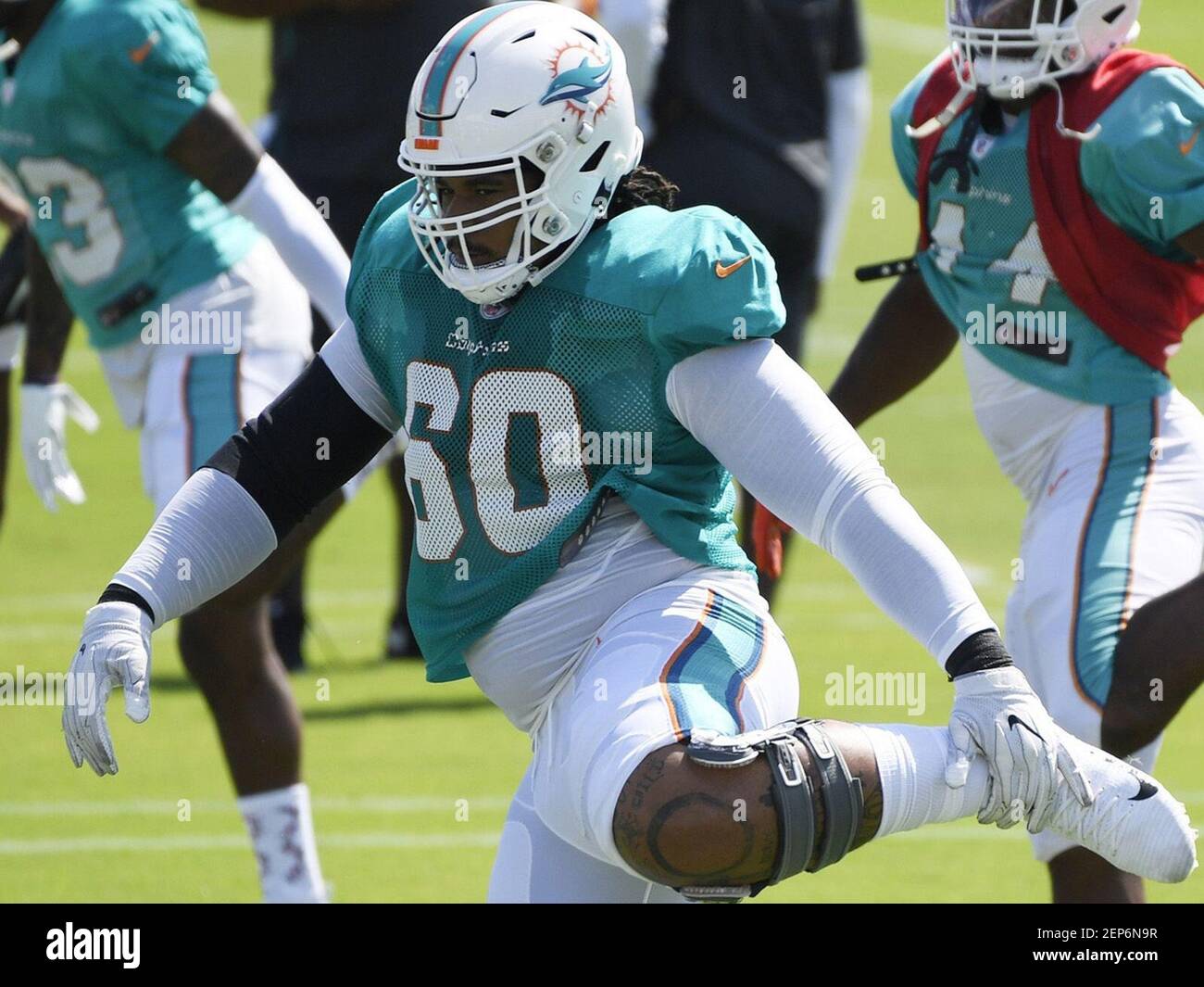 Miami Dolphins defensive lineman Robert Nkemdiche does stretch warmups ...