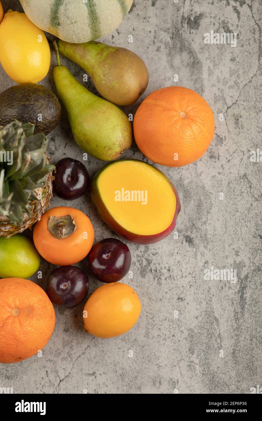 Bunch of various delicious fresh fruits on marble surface Stock Photo ...