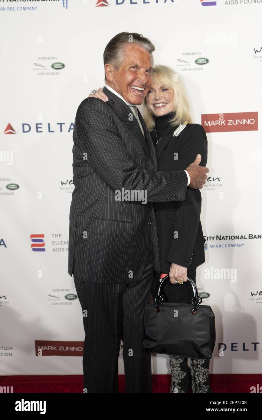 George Hamilton and Kelly Day walks the red carpet at the reception ...