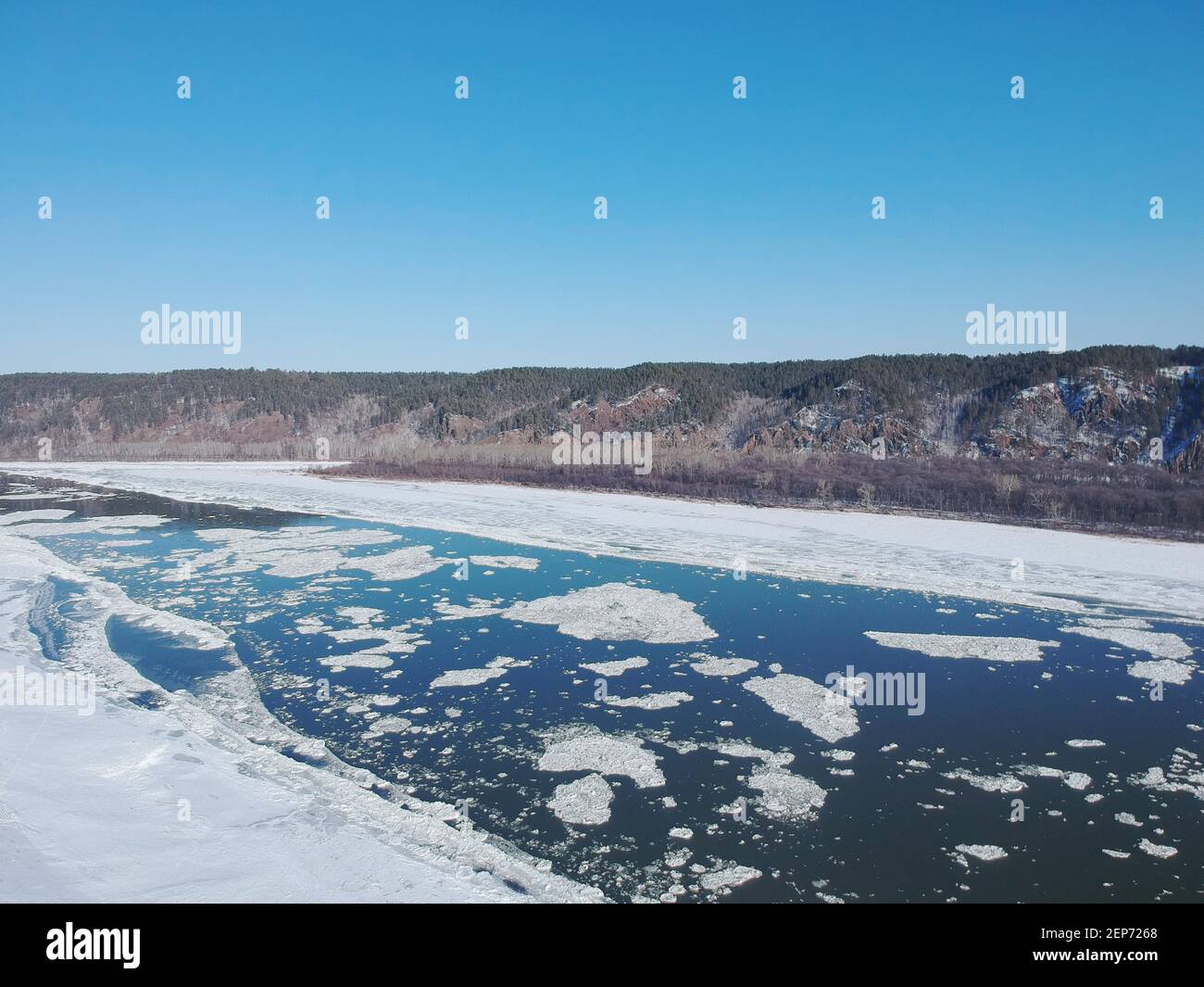 An aerial view of various ice with different shapes and areas floating ...