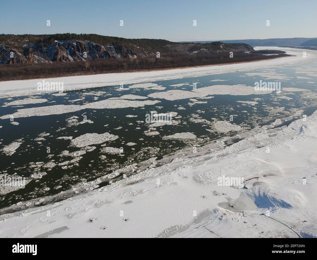 An aerial view of various ice with different shapes and areas floating ...