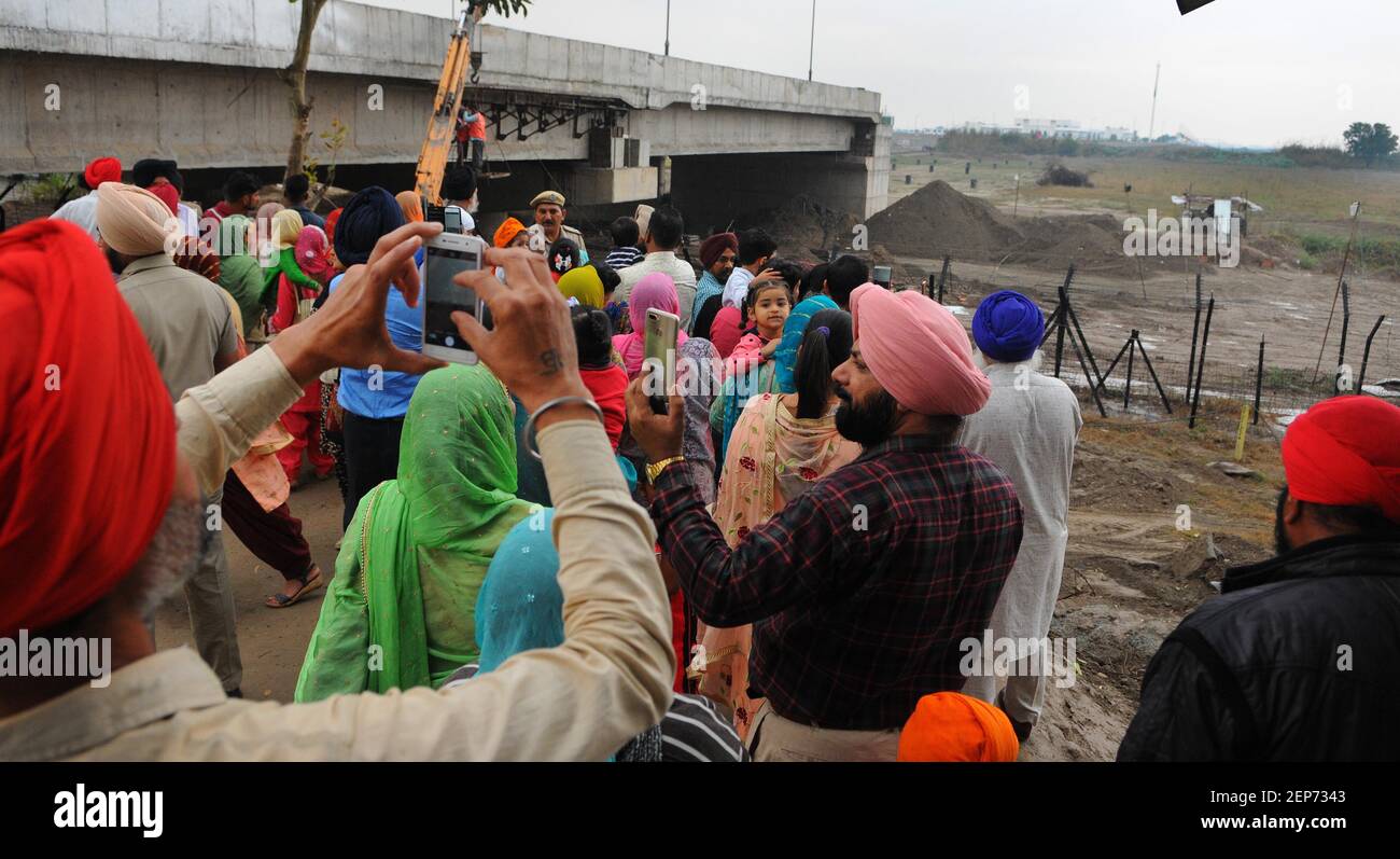 GURDASPUR, INDIA – NOVEMBER 8: Devotees take photos from thet Dera Baba ...