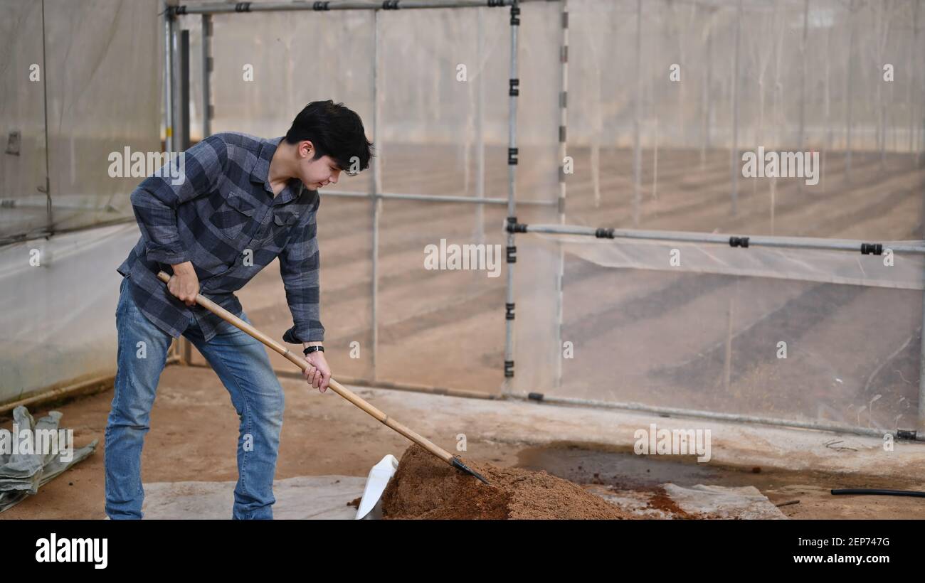 Farmer using hoe hand tool hi-res stock photography and images - Alamy