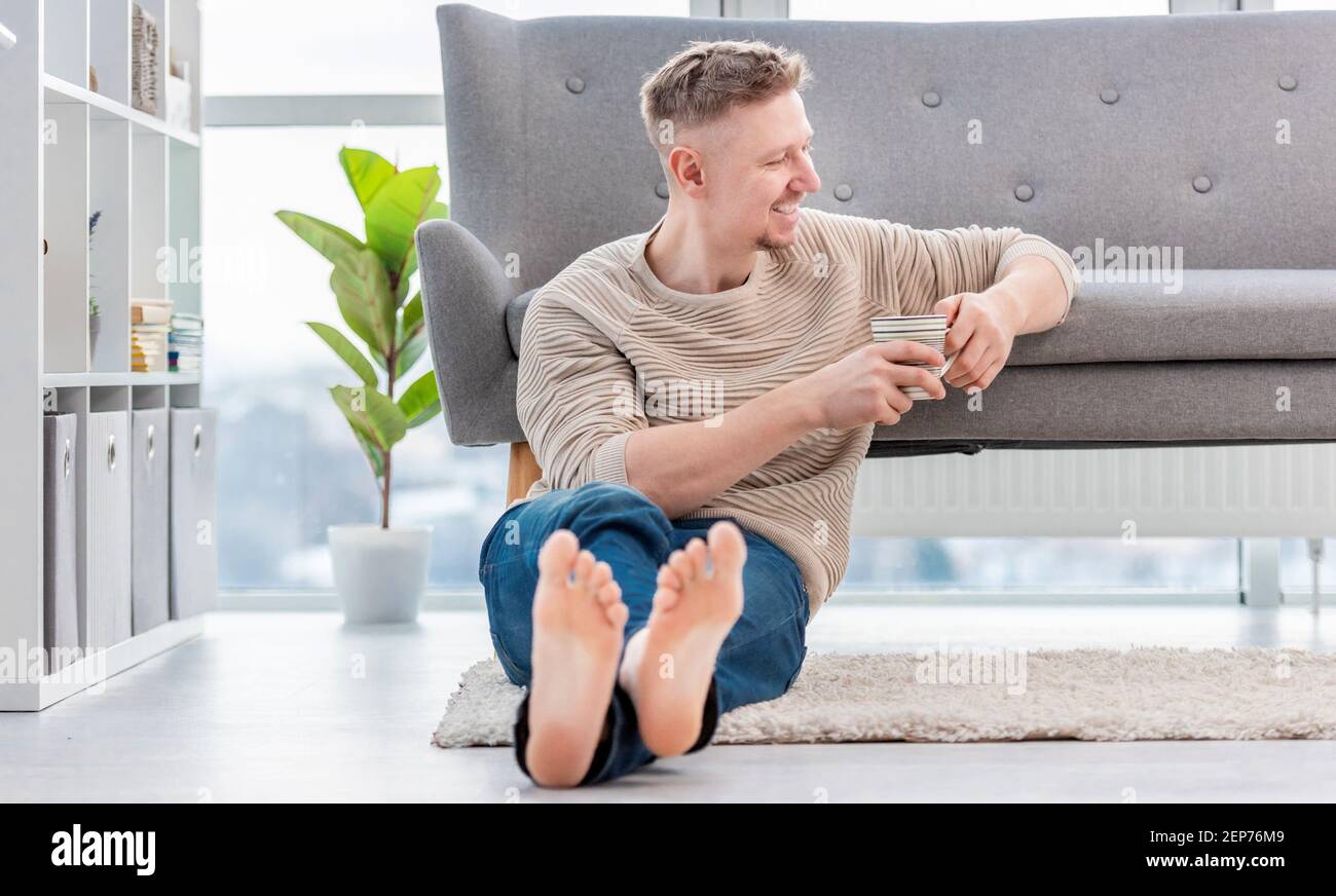 Man sitting with coffee cup Stock Photo - Alamy