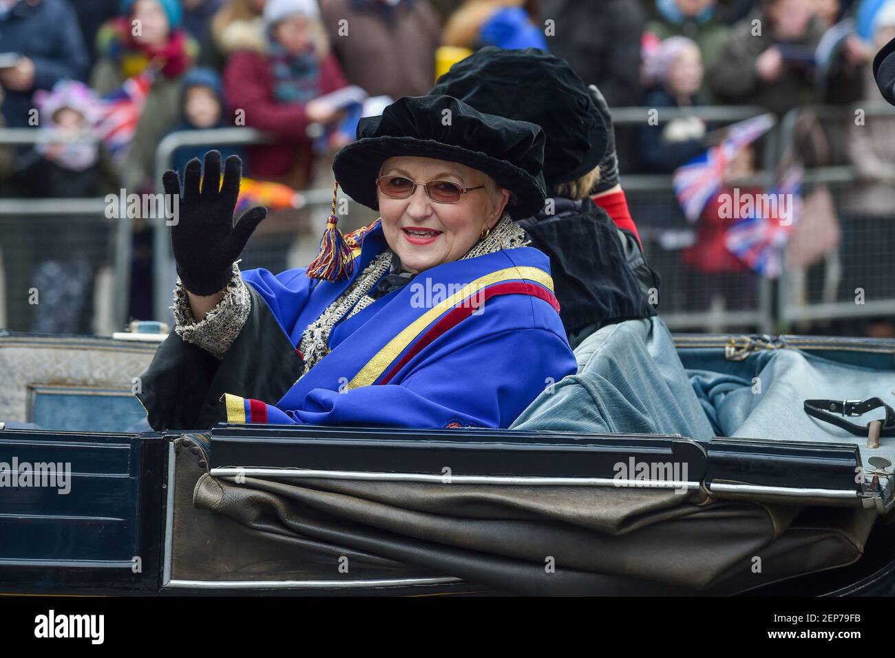 A woman in a costume waving to the crowd during The Lord Mayor's Show ...