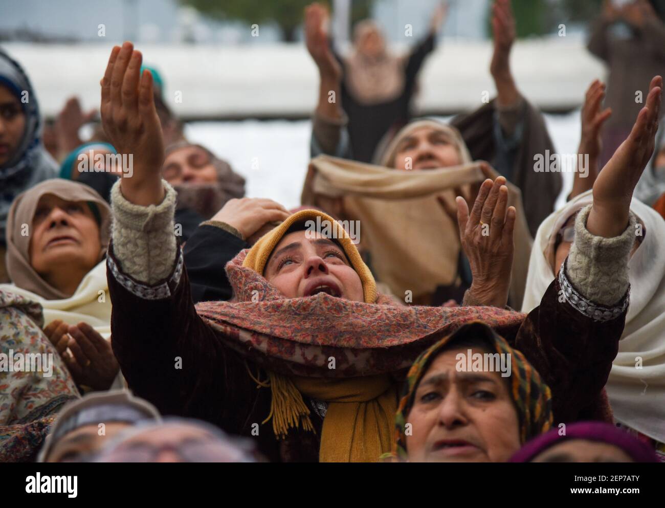 Kashmiri Muslim women raise hands while beseeching for blessings as the ...