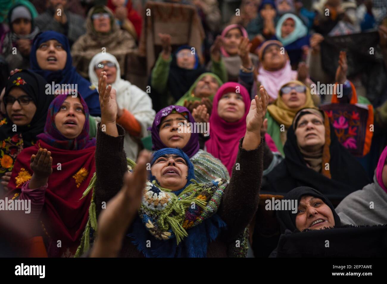 Kashmiri Muslim women raise hands while beseeching for blessings as the ...