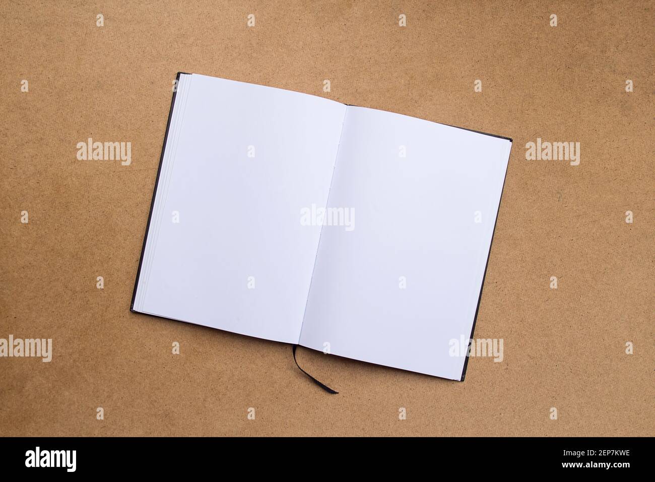 Blank notepad or notebook on brown wood table background.using ...