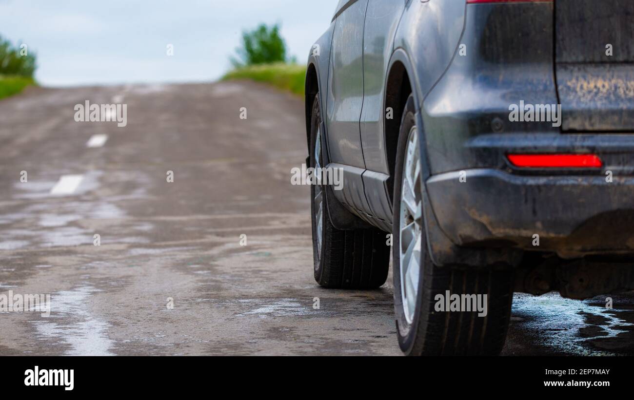 Car by the asphalt road wide and far view Stock Photo - Alamy
