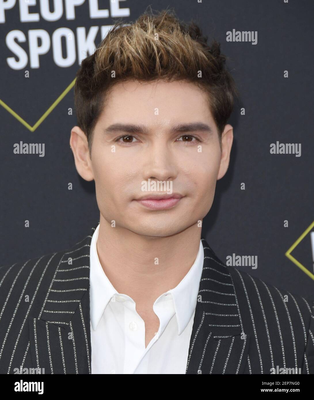 Christian Acosta arrives at the 2019 E! People’s Choice Awards held at ...