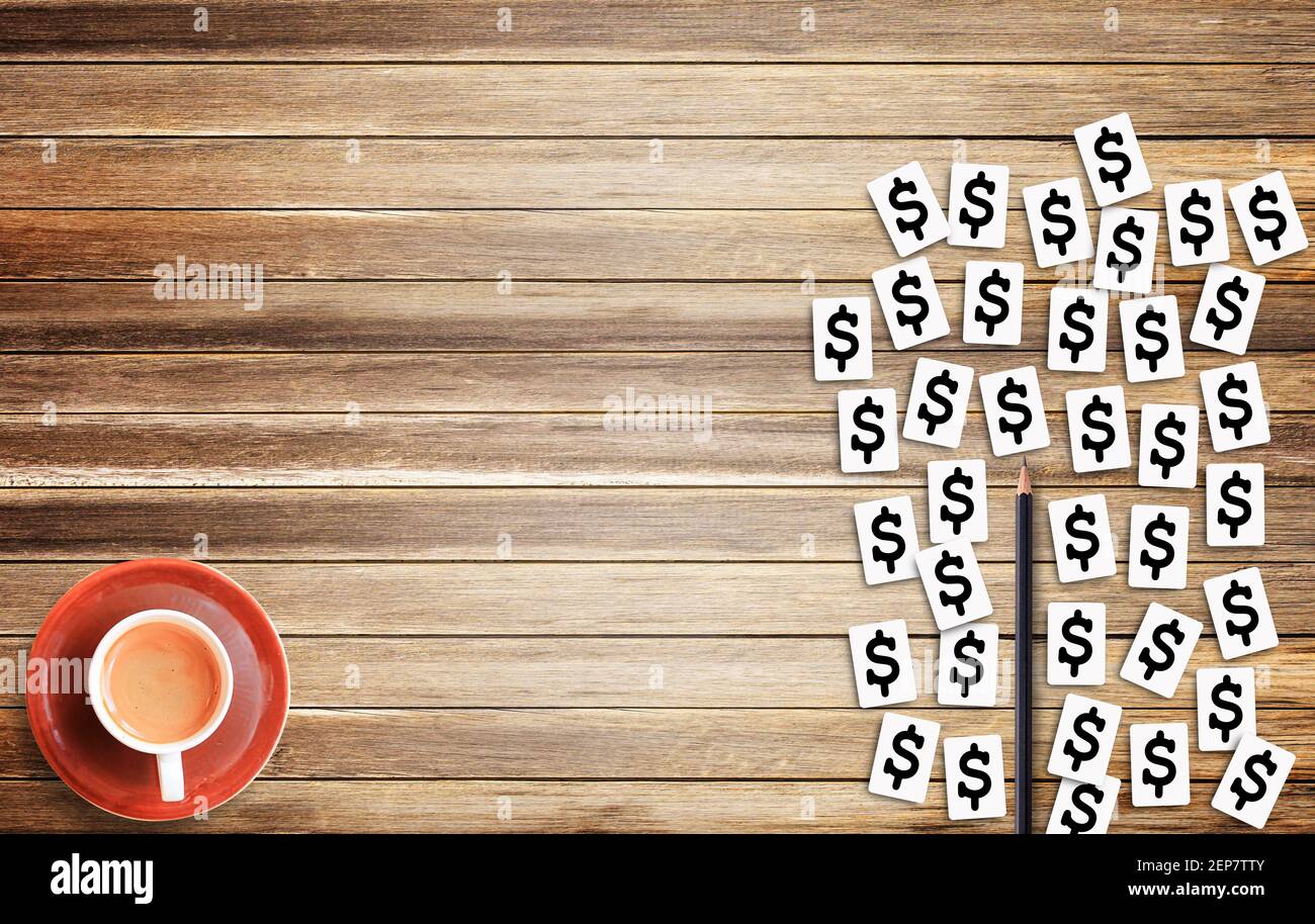 Cup of coffee with dollar sign and pencil on wood table background. Top ...