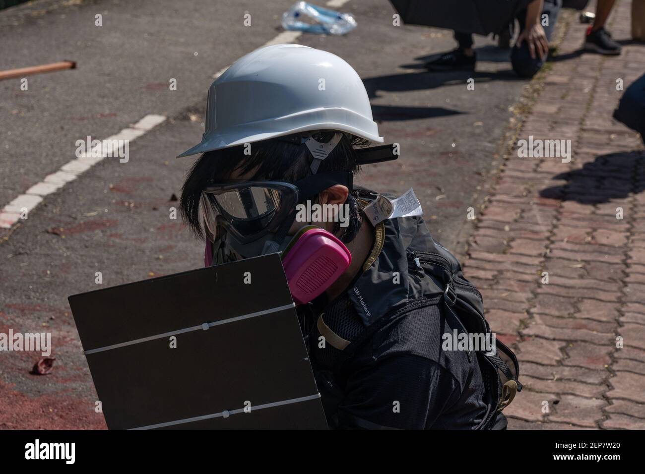 Protester with a gas mask and a shield during the demonstration. A ...