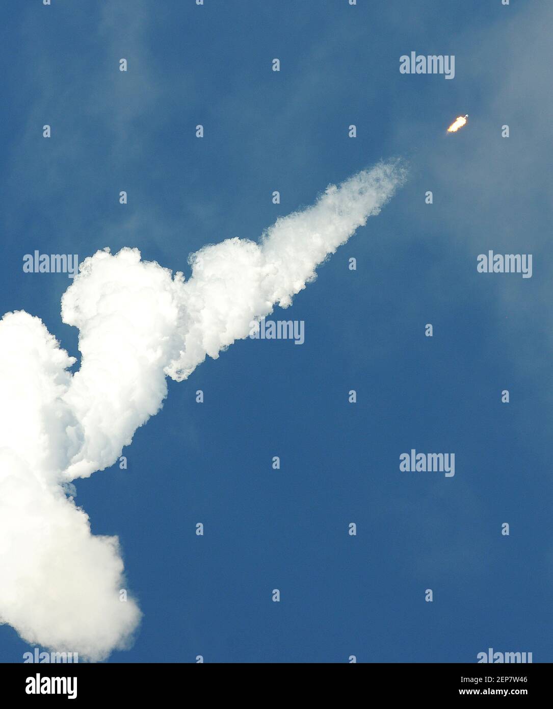 A SpaceX Falcon 9 rocket leaves a trail after successfully being ...