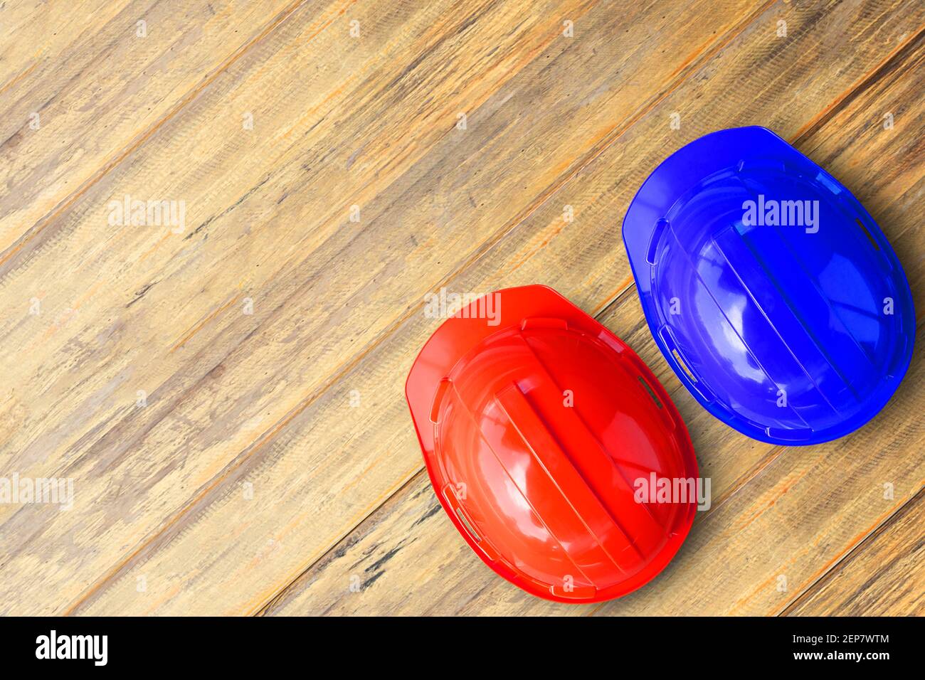 Group of safety engineer helmets on wood background. Industrial safety ...