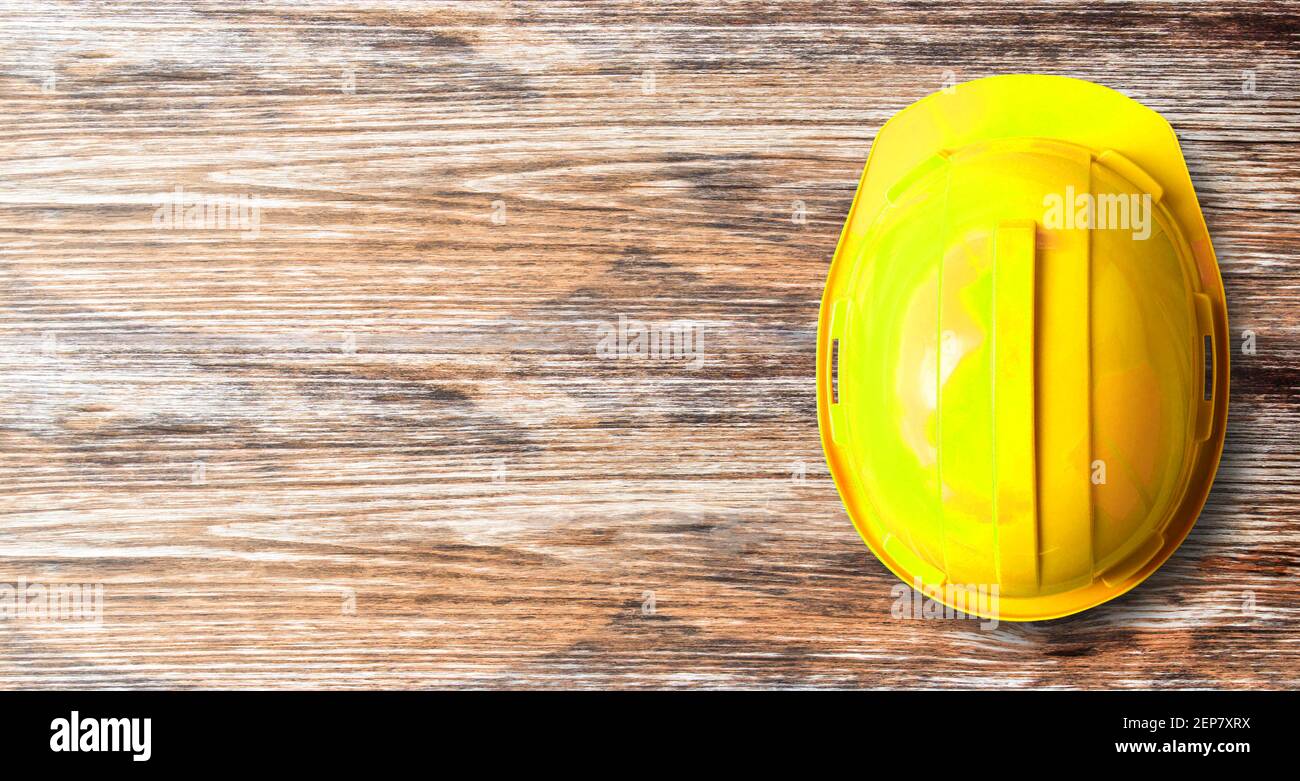Top view of yellow safety helmet hat in the project at construction ...