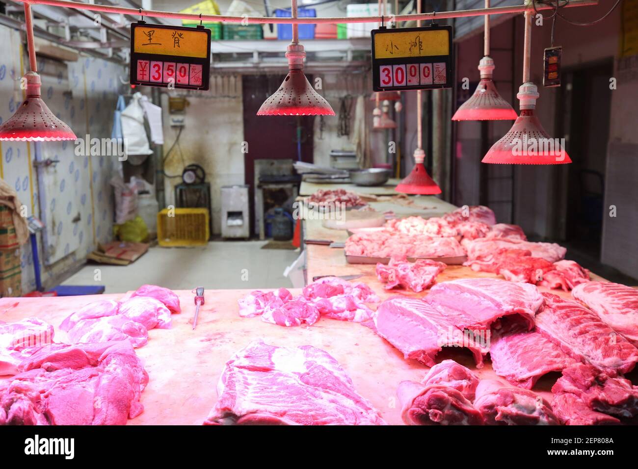 Pork is presented for sales at the meat stall in a market in Xi'an city ...