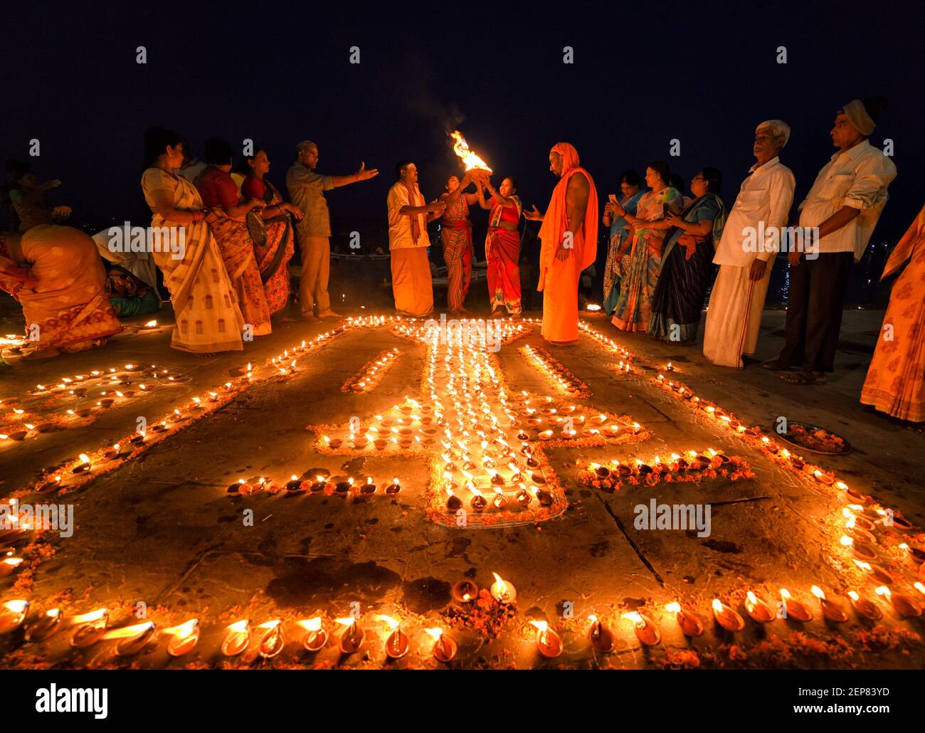 Indian Hindu devotees light Lamps while Praying to God on the eve of ...