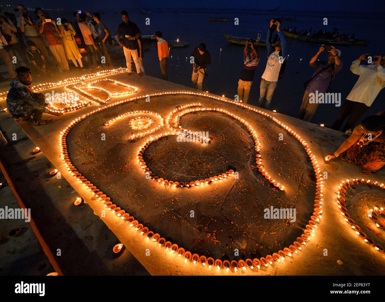 Indian Hindu devotees light Lamps while Praying to God on the eve of ...