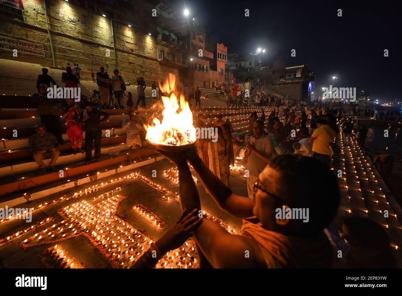 Indian Hindu devotees light Lamps while Praying to God on the eve of ...