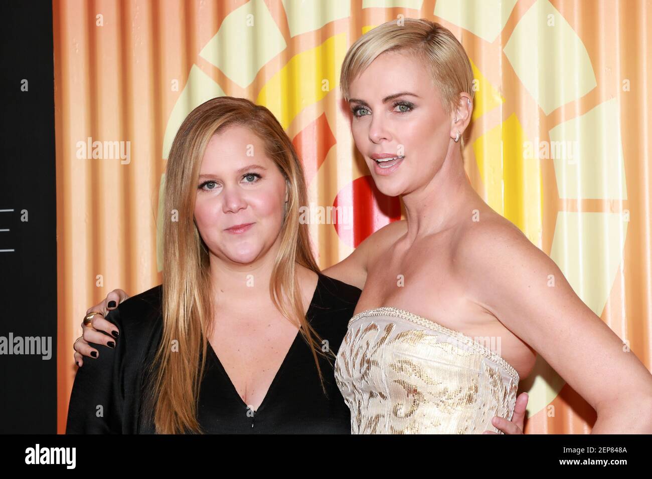 Amy Schumer and Charlize Theron attend Charlize Theron's Africa ...