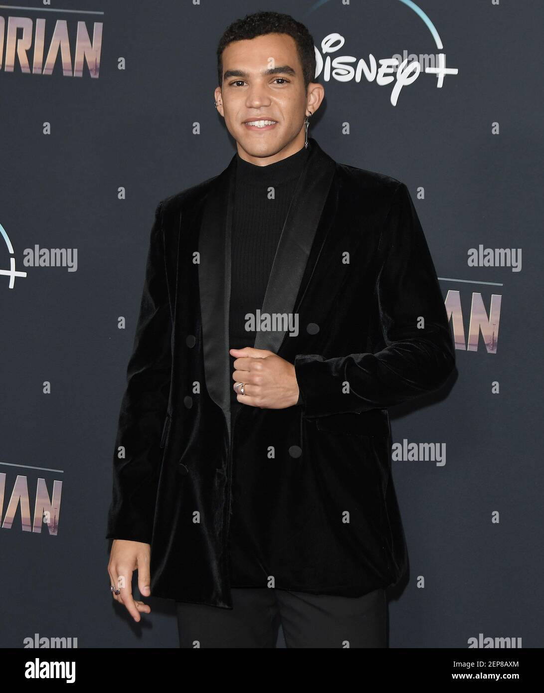 Adam Faison arrives at the Disney+'s THE MANDALORIAN Premiere held at ...