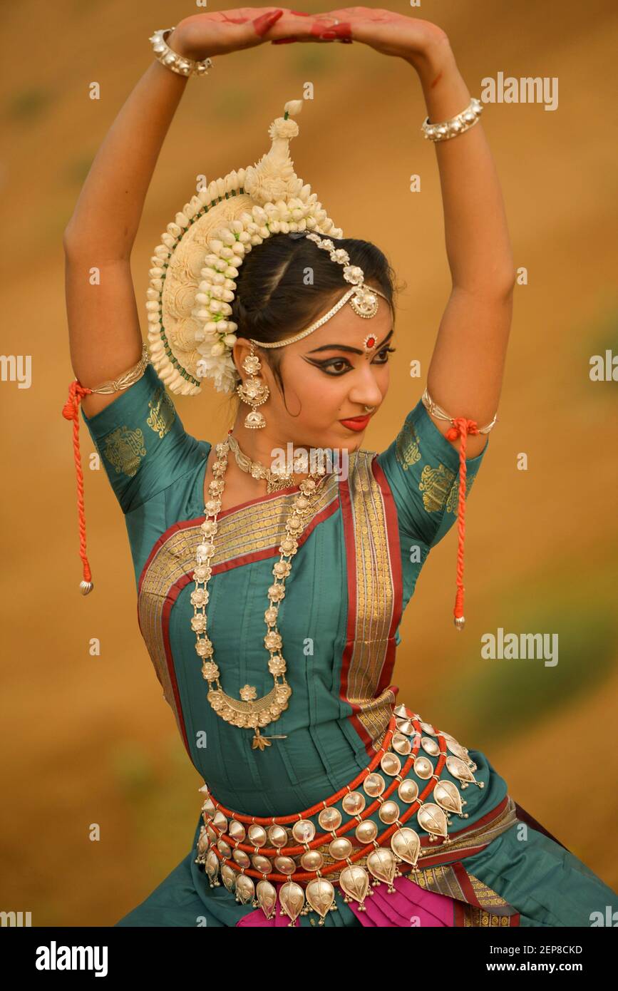 Tejaswini Gautam perform Odissi dance in desert of Rajasthan. Odissi is one of the classical ...