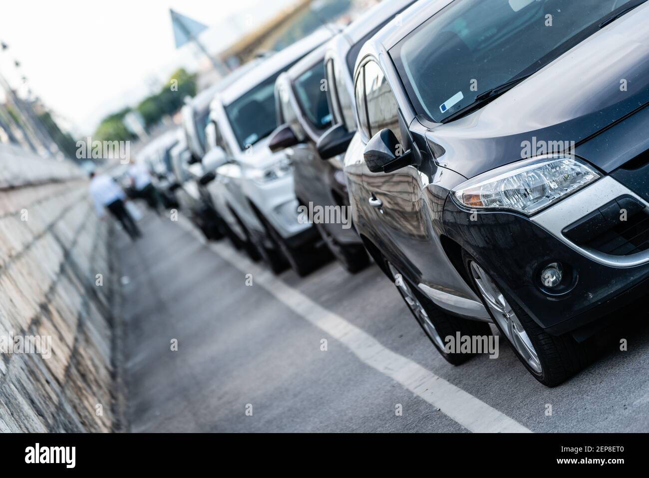 Many cars travelling on a road Stock Photo - Alamy