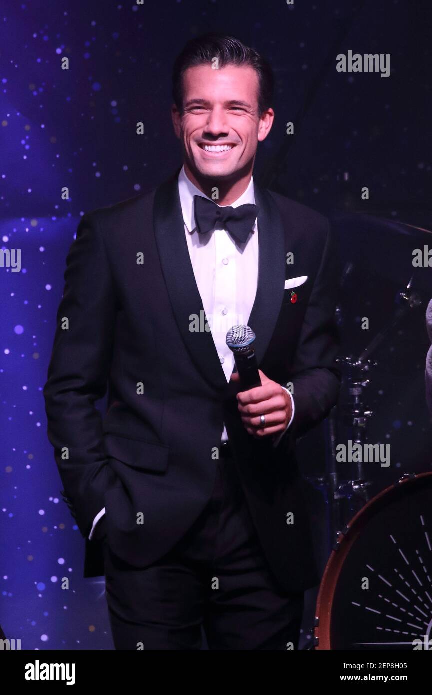 Danny Mac from the cast of White Christmas on stage during the Regent Street Christmas lights ...
