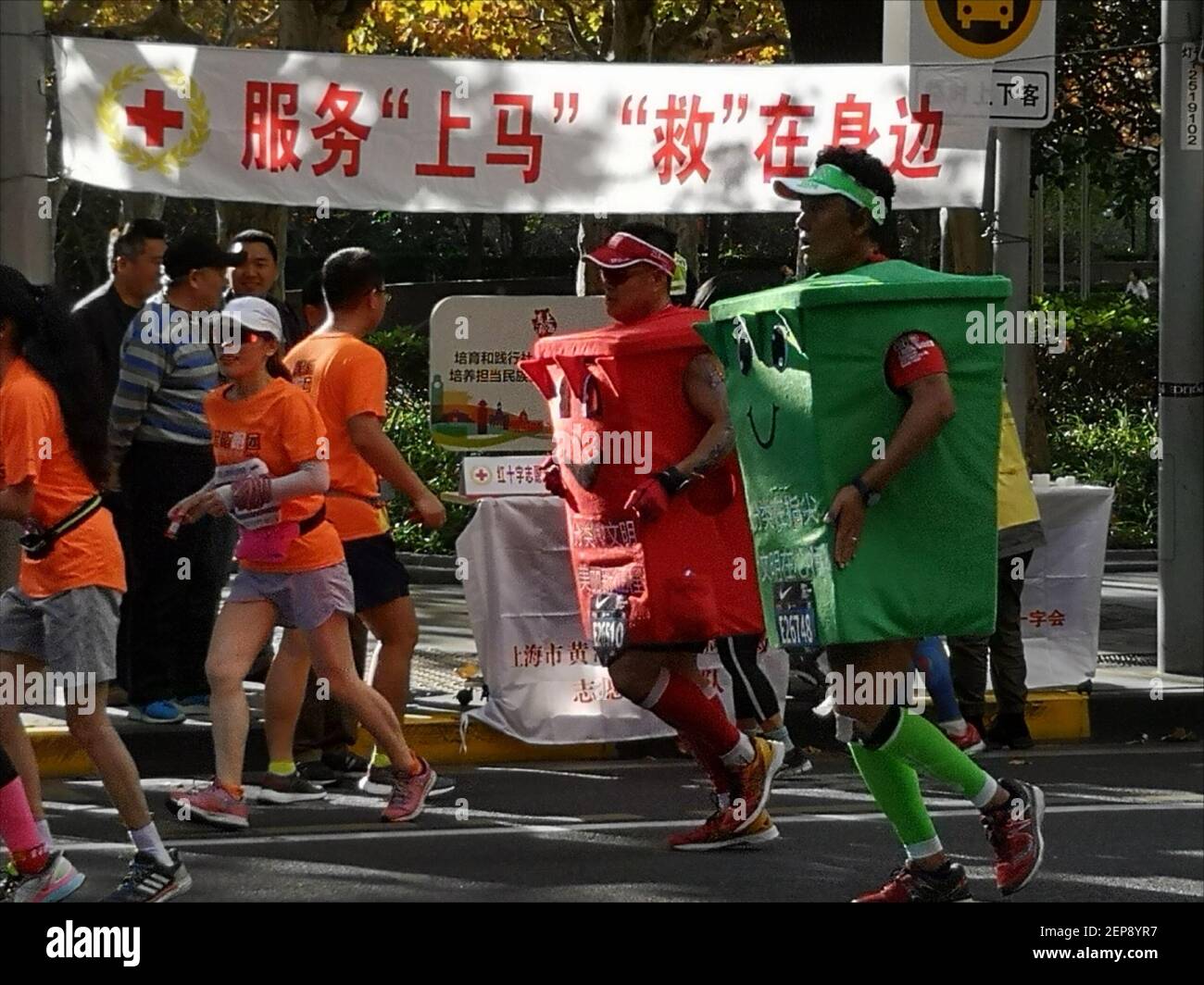 Two runners dress up as dustbins to echo the regulation of garbage ...