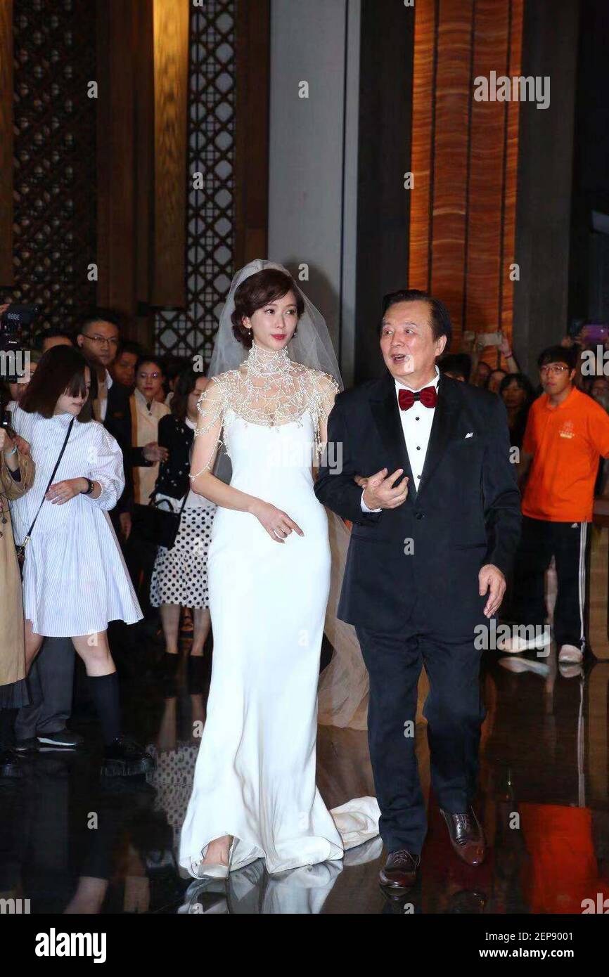 Taiwanese model and actress Lin Chi-ling, middle left, holds hand of ...