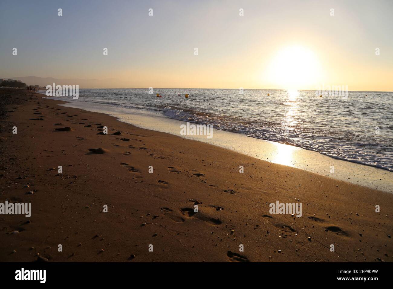 Waves of the sea, illuminated by sunlight at sunset. Costa del Sol ...