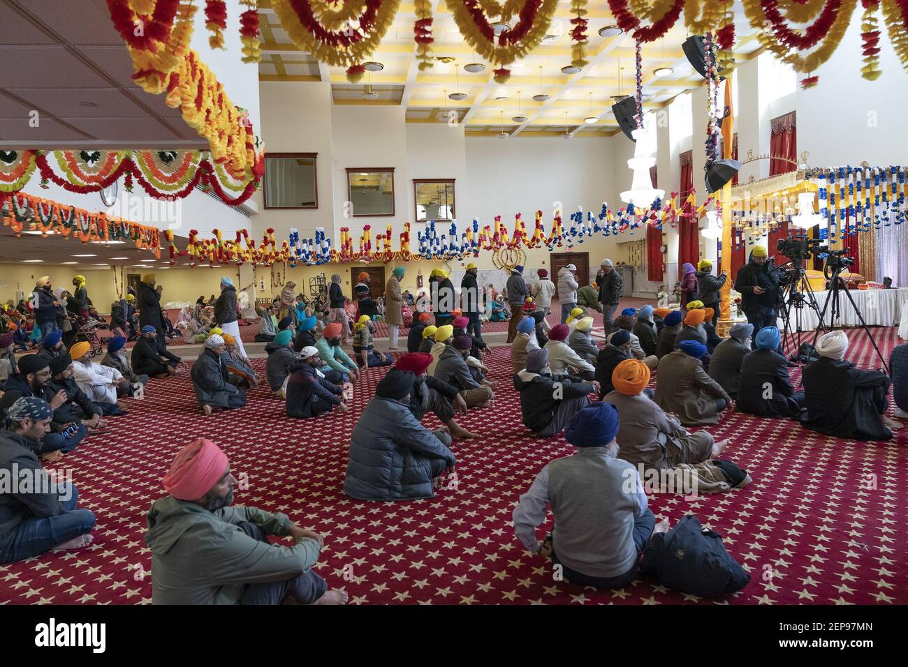 Indian-American men pray during 550th Birthday of Guru Nanak Dev Ji ...