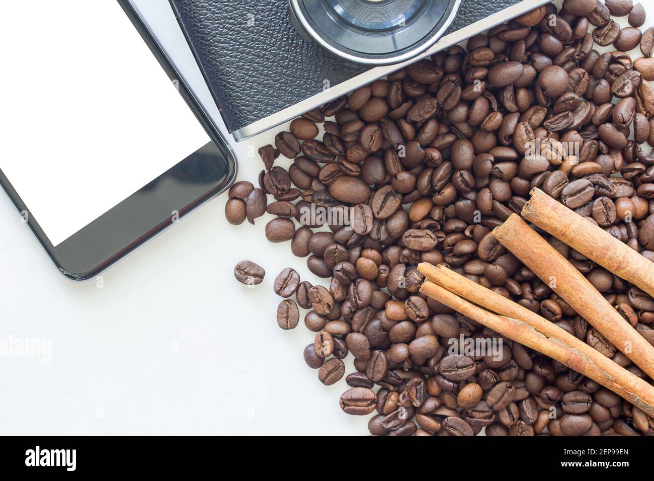 Smart phone,camera and coffee beans on white background. top view Stock ...
